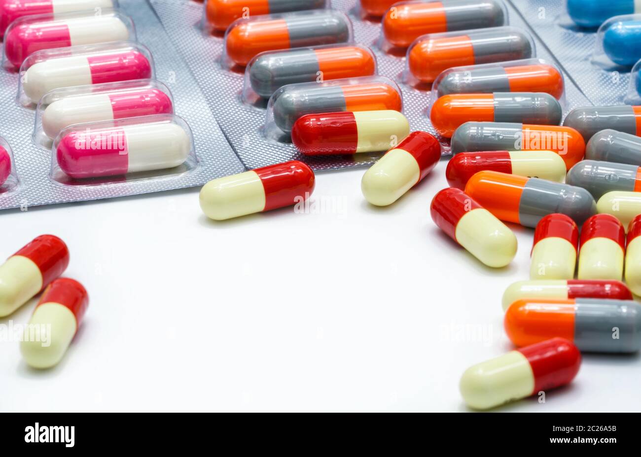 Pile of colorful antibiotic capsule pills. Antimicrobial drug ...