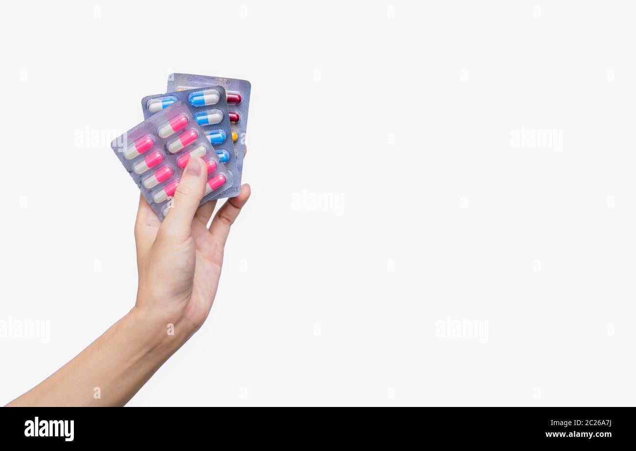 Asian adult hand holding antibiotics drug in blister pack. Woman hand ...