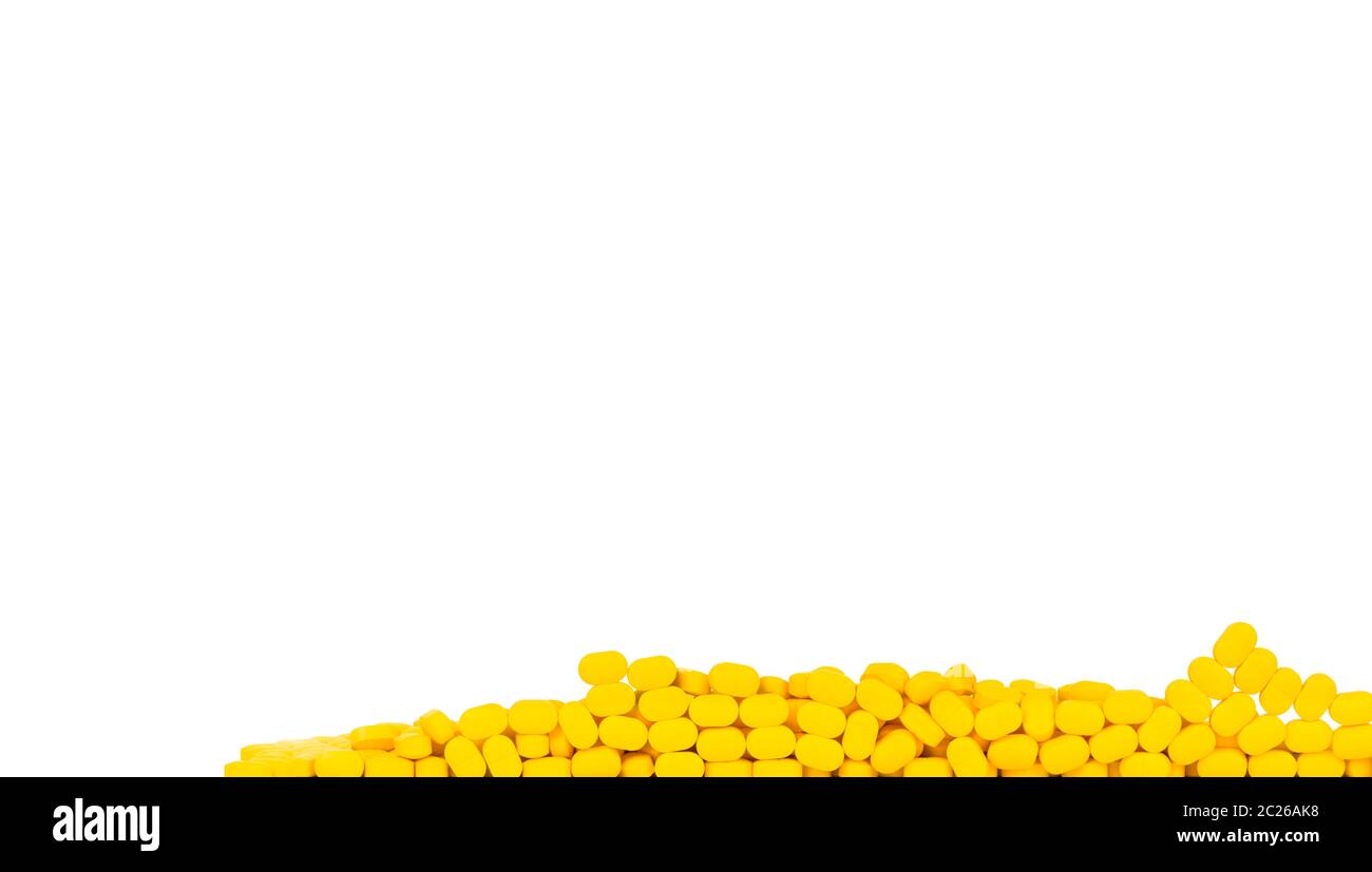 Yellow tablets pills isolated on white background with copy space for ...