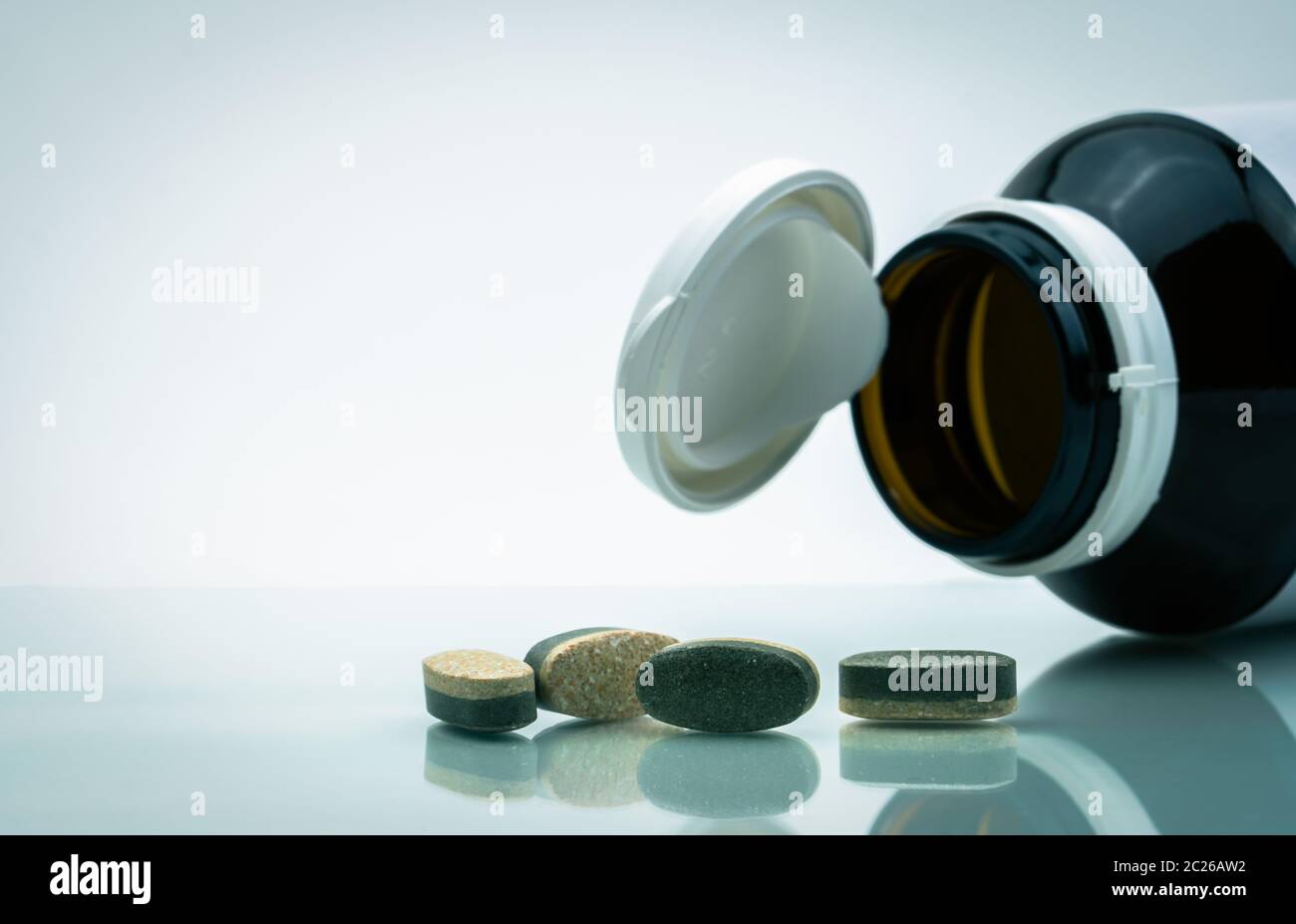 Essential Vitamins and minerals supplements dual layer tablet pills and ...