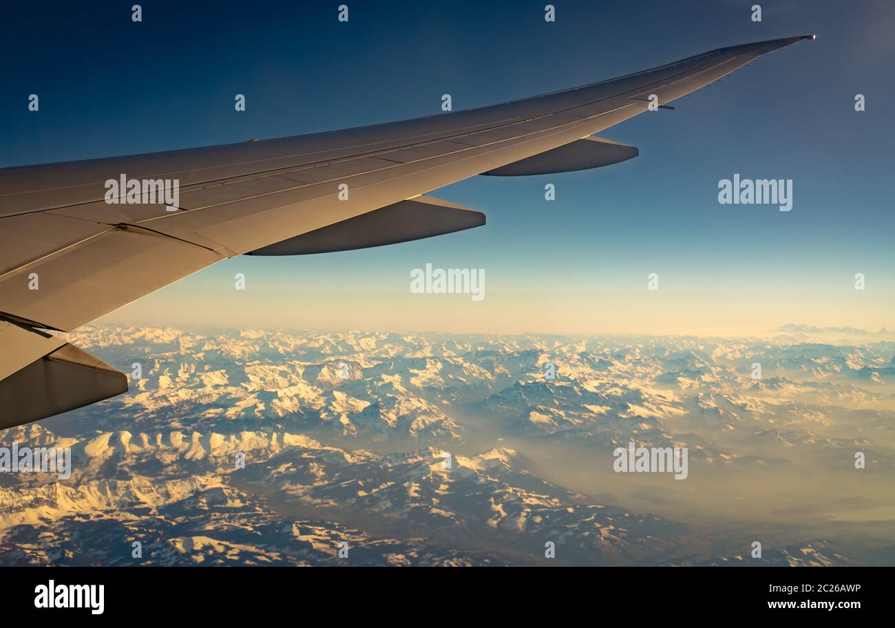 Aeroplane flying over mountain peak hi-res stock photography and images ...