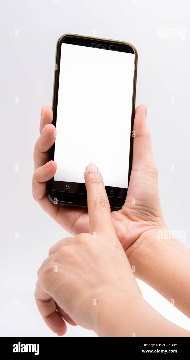 Close-up hand touching smartphone screen isolated on white background ...