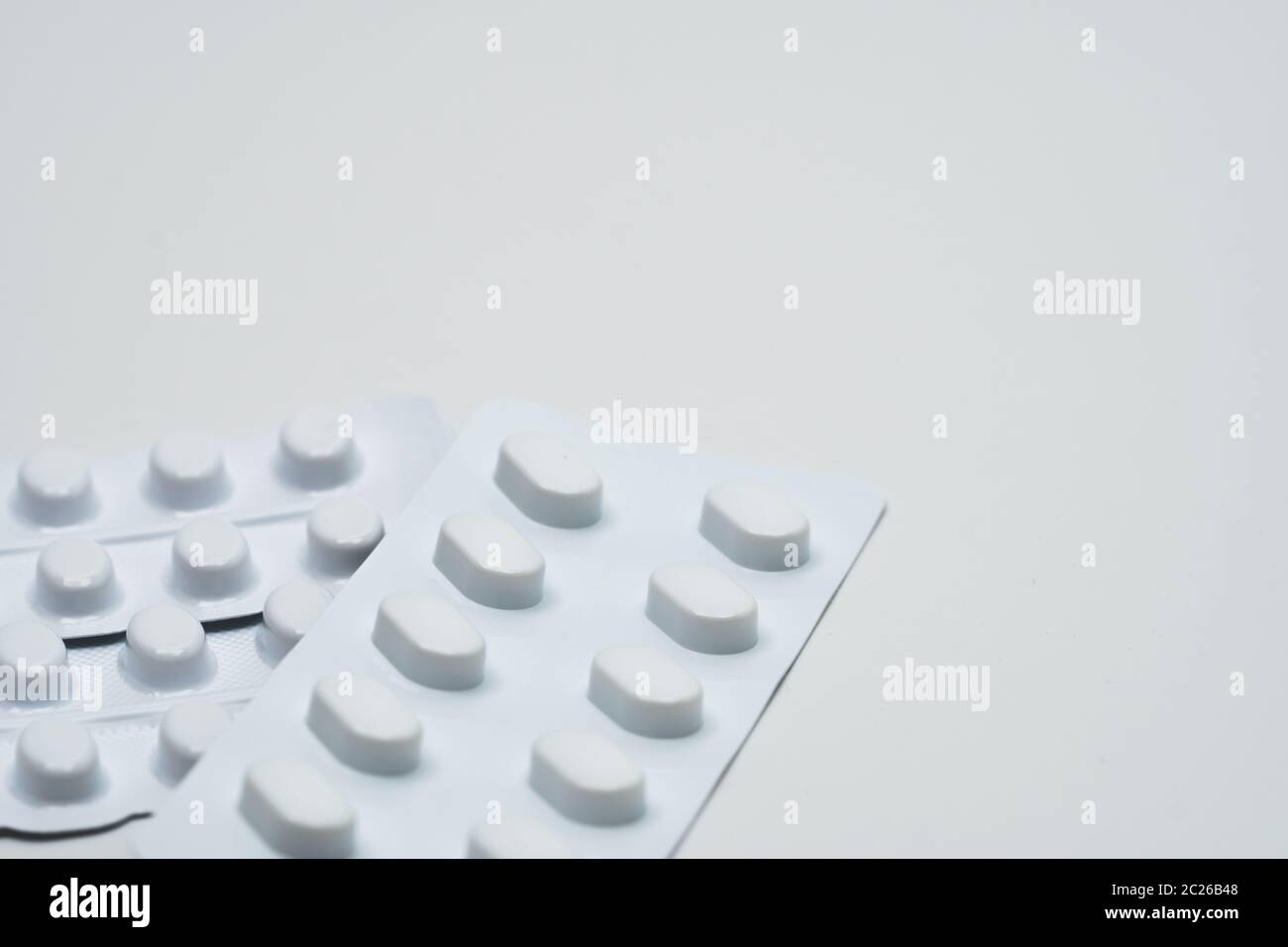 Macro shot detail of tablets pill in white blister pack for light ...