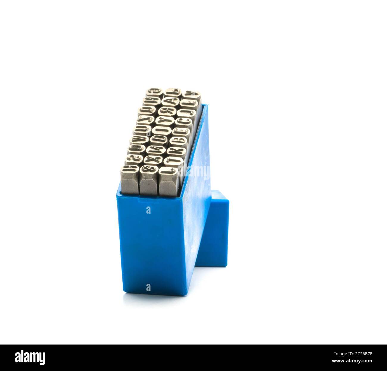 Set of metal stamp alphabet punch in blue plastic box isolated on white ...