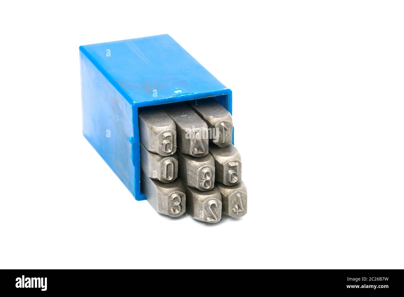 Set of metal stamp number punch in blue plastic box isolated on white ...