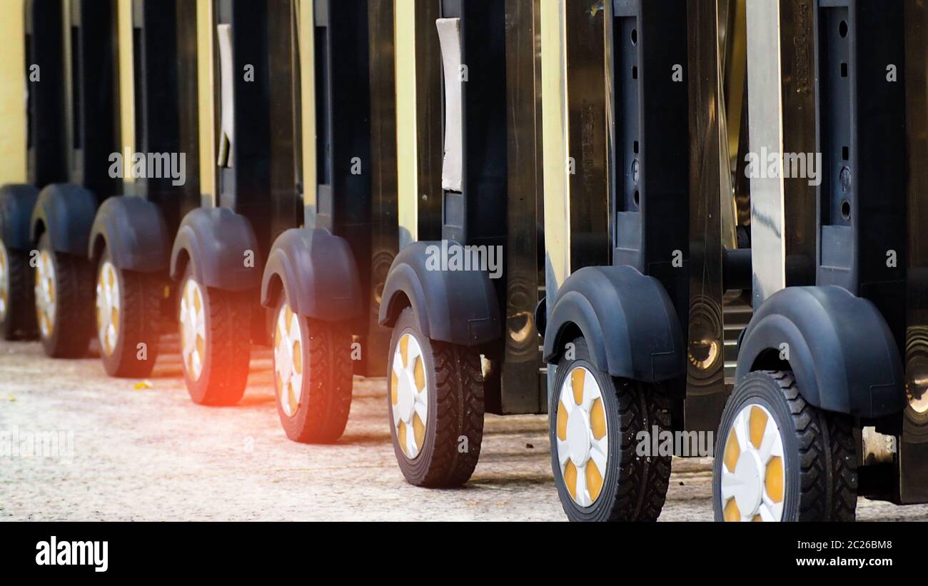 Selective focus on wheels of stainless steel movable fence. Foldable ...