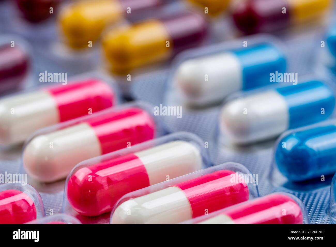 Colorful antibiotic capsule pills in blister pack. Pharmaceutical ...