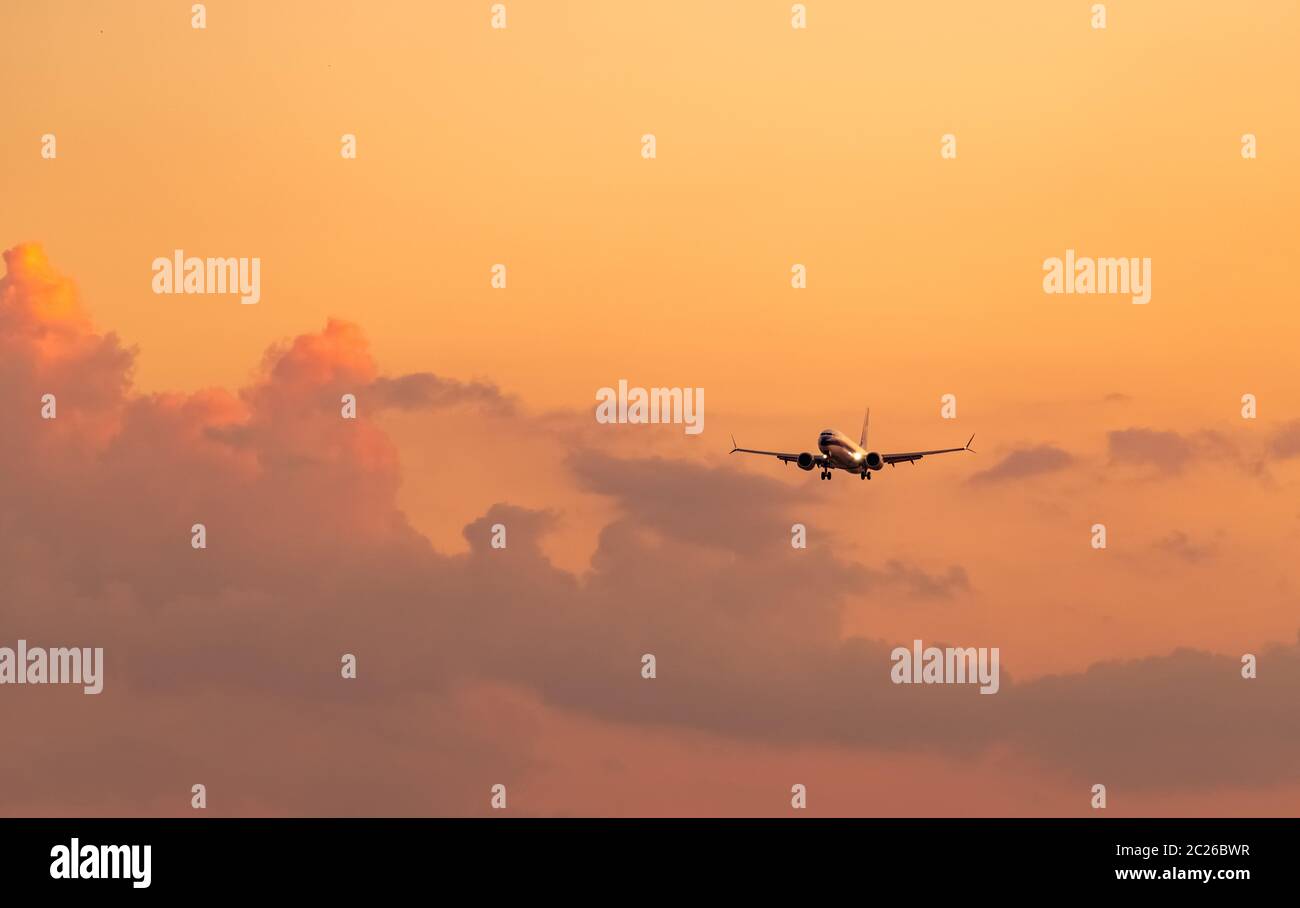 Commercial airline. Passenger plane landing at airport with beautiful ...