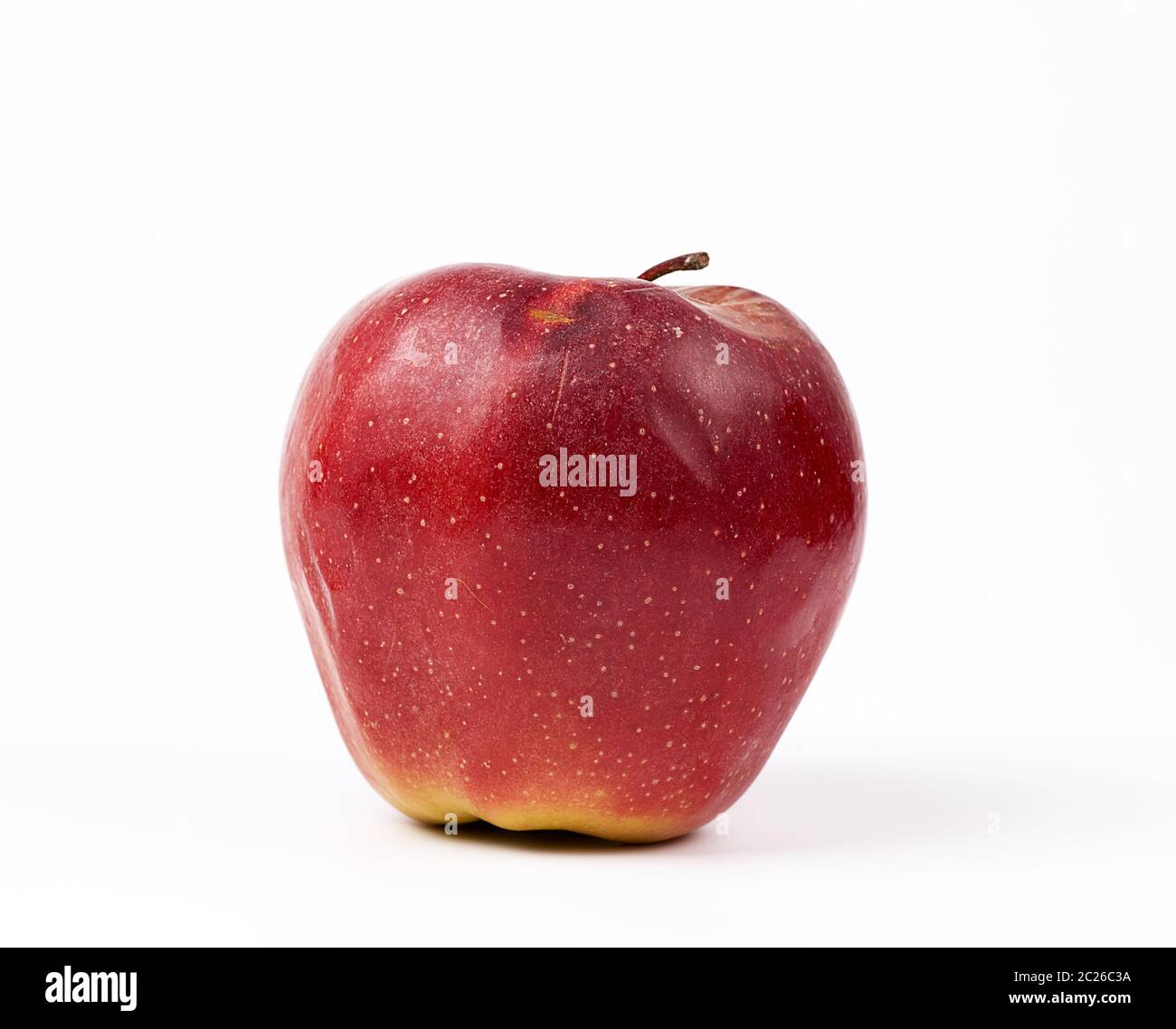 red ripe apple with defects on a white background, close up Stock Photo ...