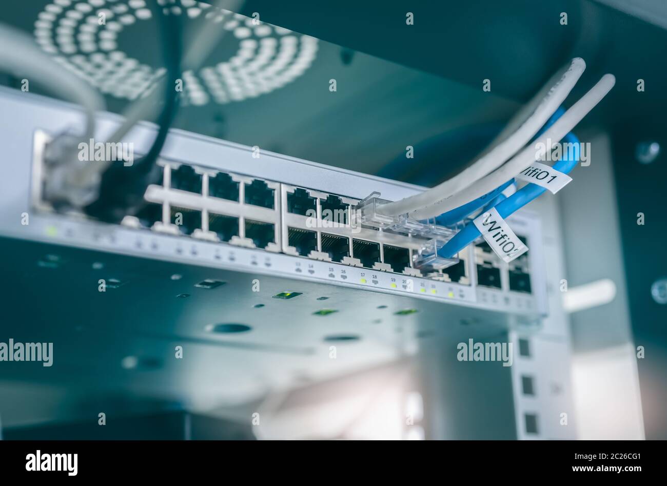 Ethernet cables and Network switch in data center. Wifi plug of ...