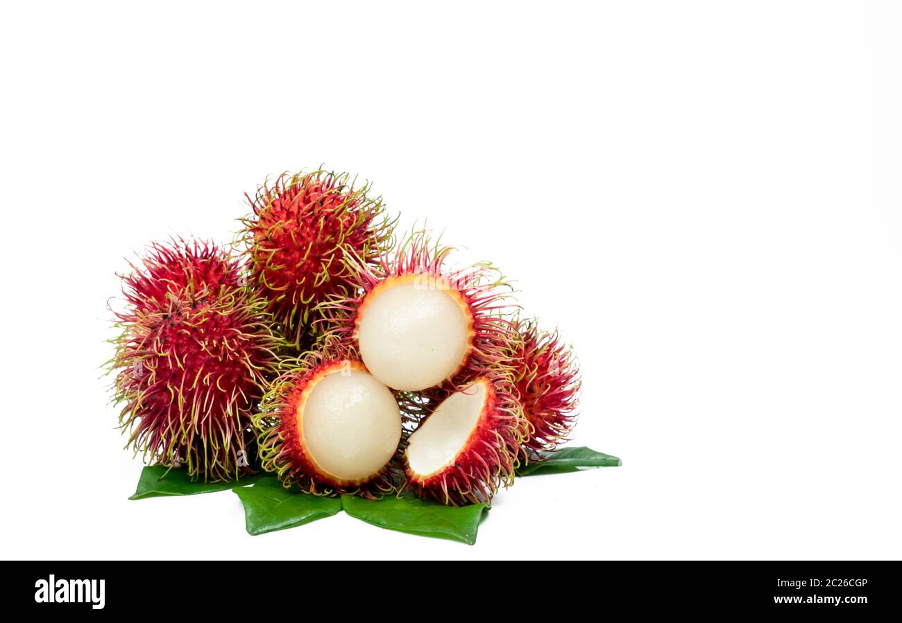 Closeup of fresh red ripe rambutan (Nephelium lappaceum) with leaves ...