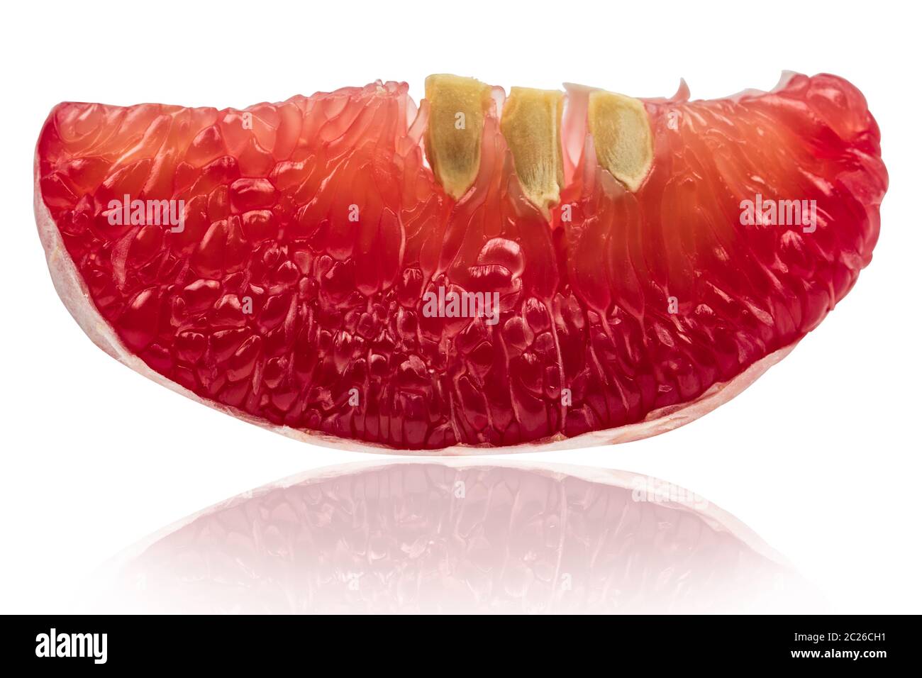 Closeup view of red pomelo pulp with seeds isolated on white background ...