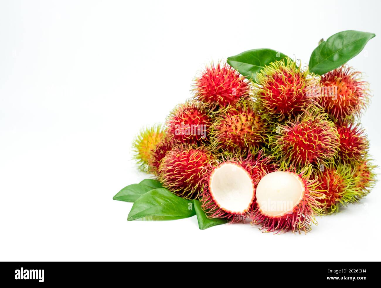 Closeup of fresh red ripe rambutan (Nephelium lappaceum) with leaves ...