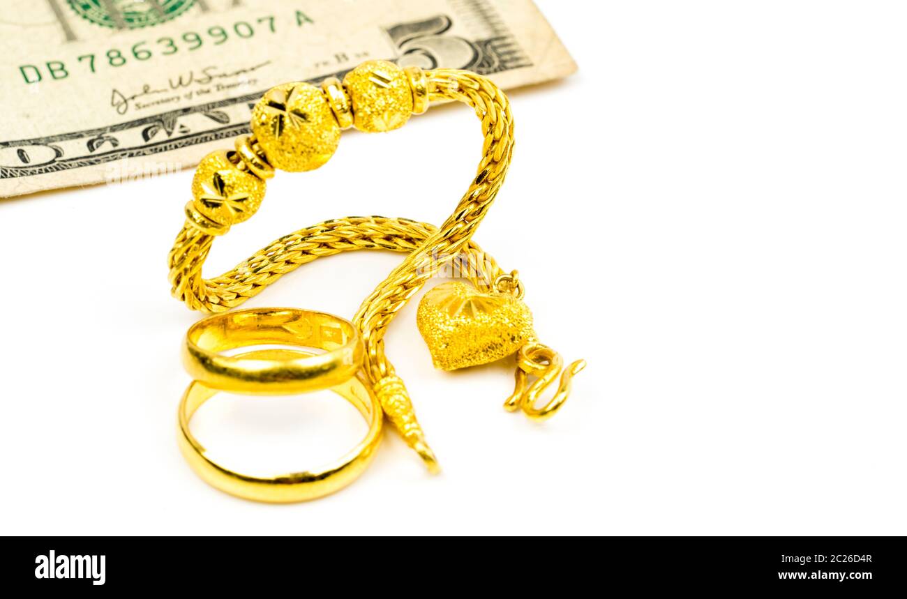 Thai style gold jewelry bracelet, couple gold ring and dollars bill ...