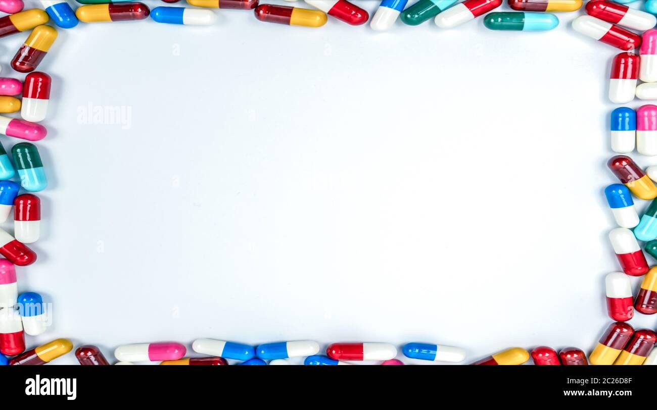 Colorful of antibiotics capsule pills rectangle frame on white ...