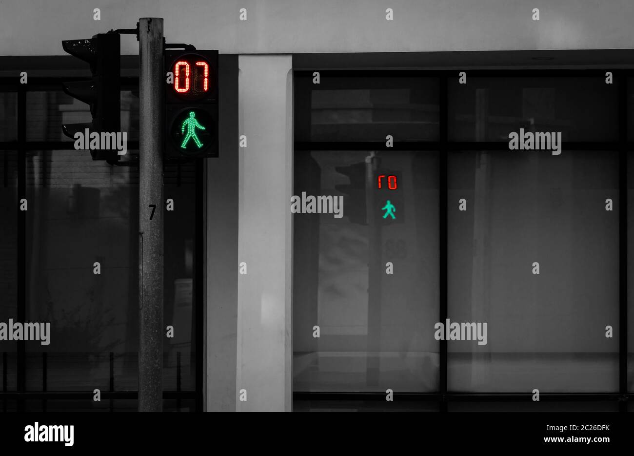 Pedestrian signals on traffic light pole. Pedestrian crossing sign for ...