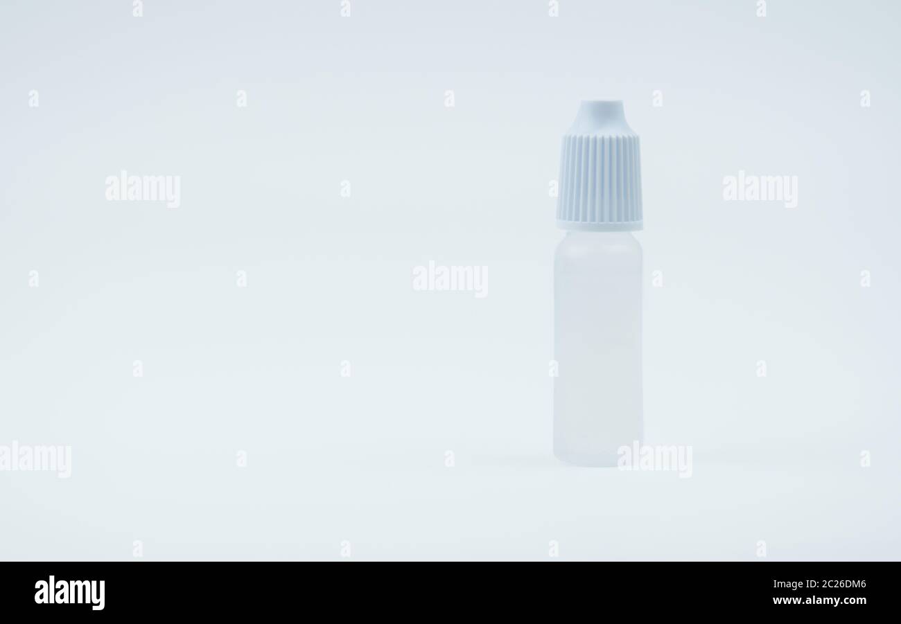 Eye drops bottle with white cap on white background with blank label ...