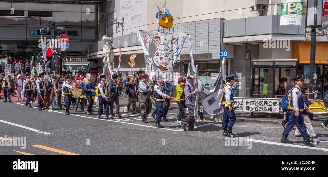 Japanese group holding a protest demonstration in the street of Shibuya ...