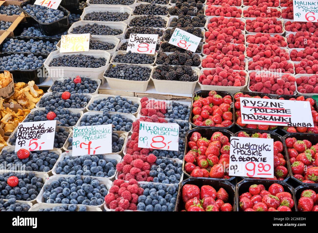 Different kinds of berries for sale at a market Stock Photo - Alamy