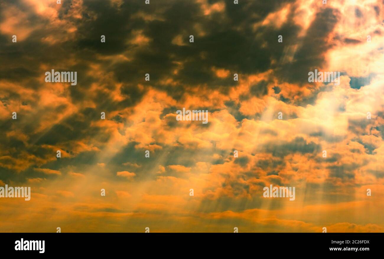 God light. Dramatic dark cloudy sky with sun beam. Yellow sun rays ...