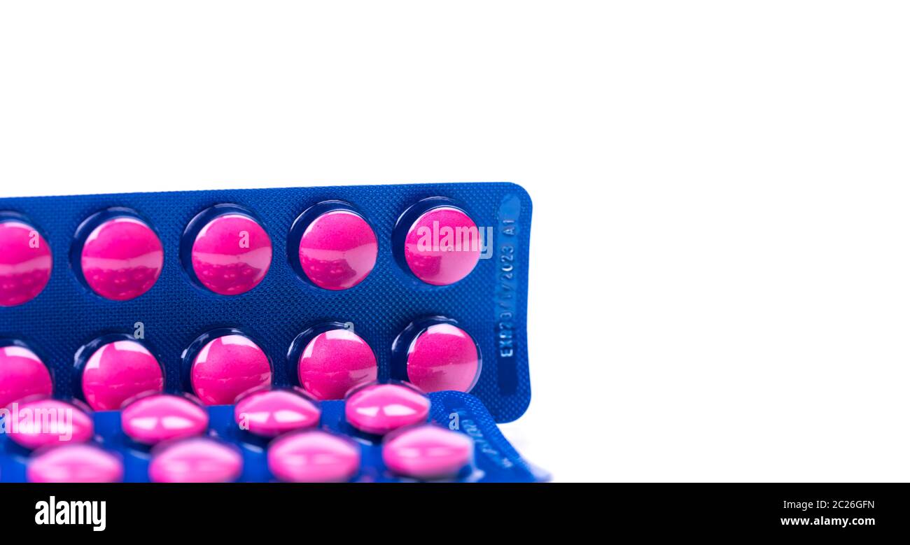 Ibuprofen in pink tablet pills pack in blue blister pack isolated on ...