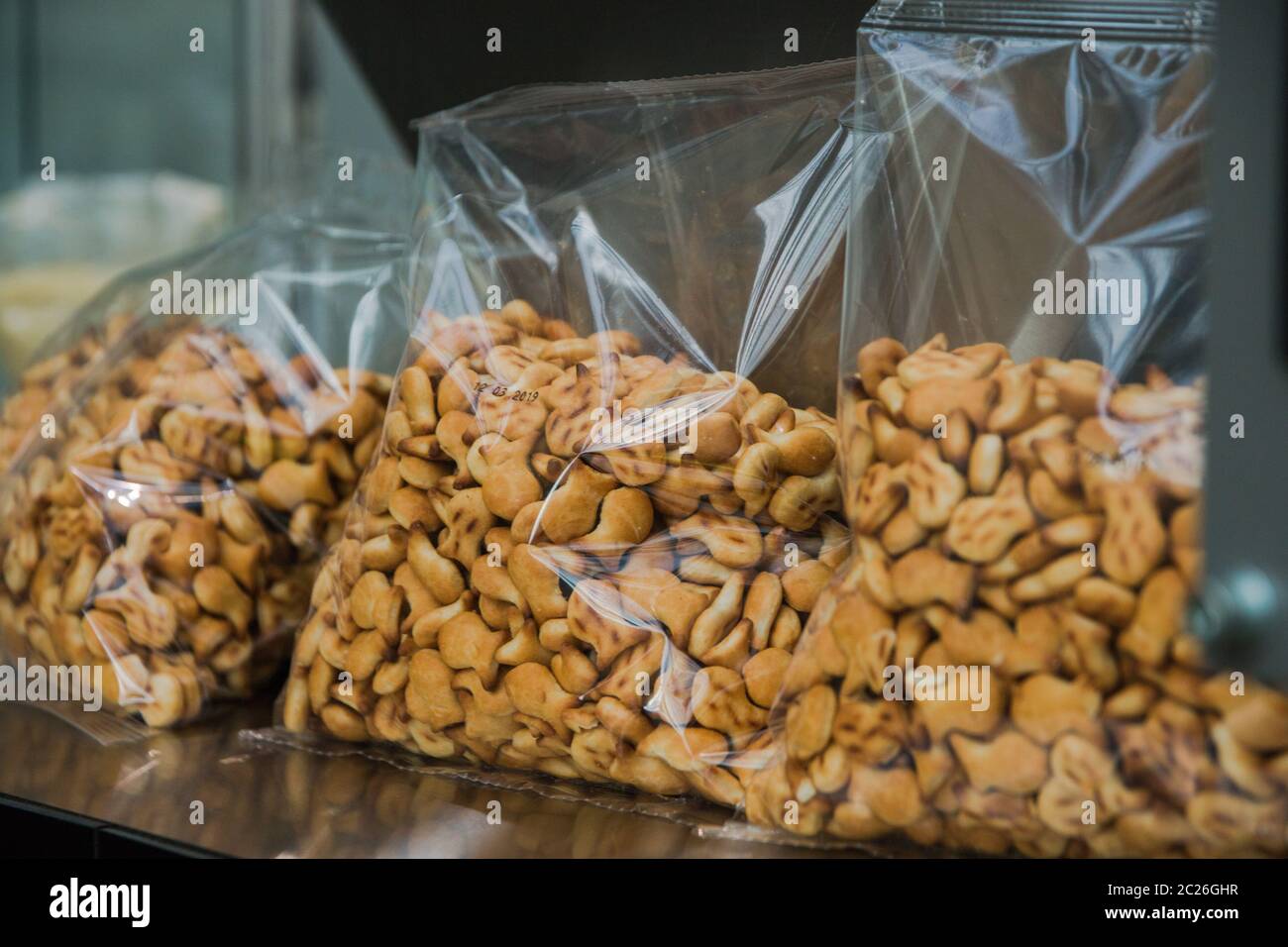 Salted Fish Crackers in packages on store shelves, cookies snacks ...