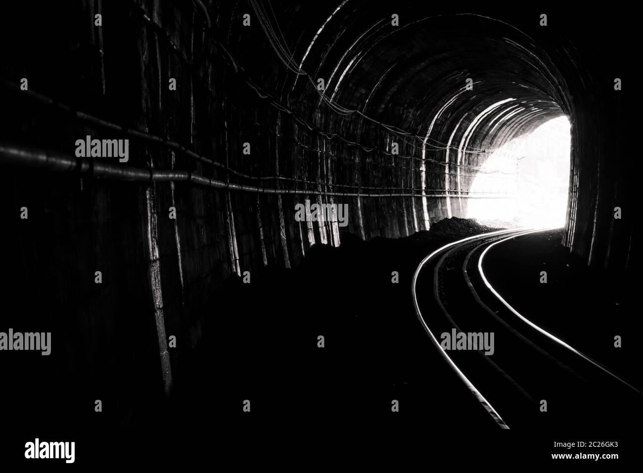 Train tunnel. Old railway in cave. Hope of life in the end of the way ...