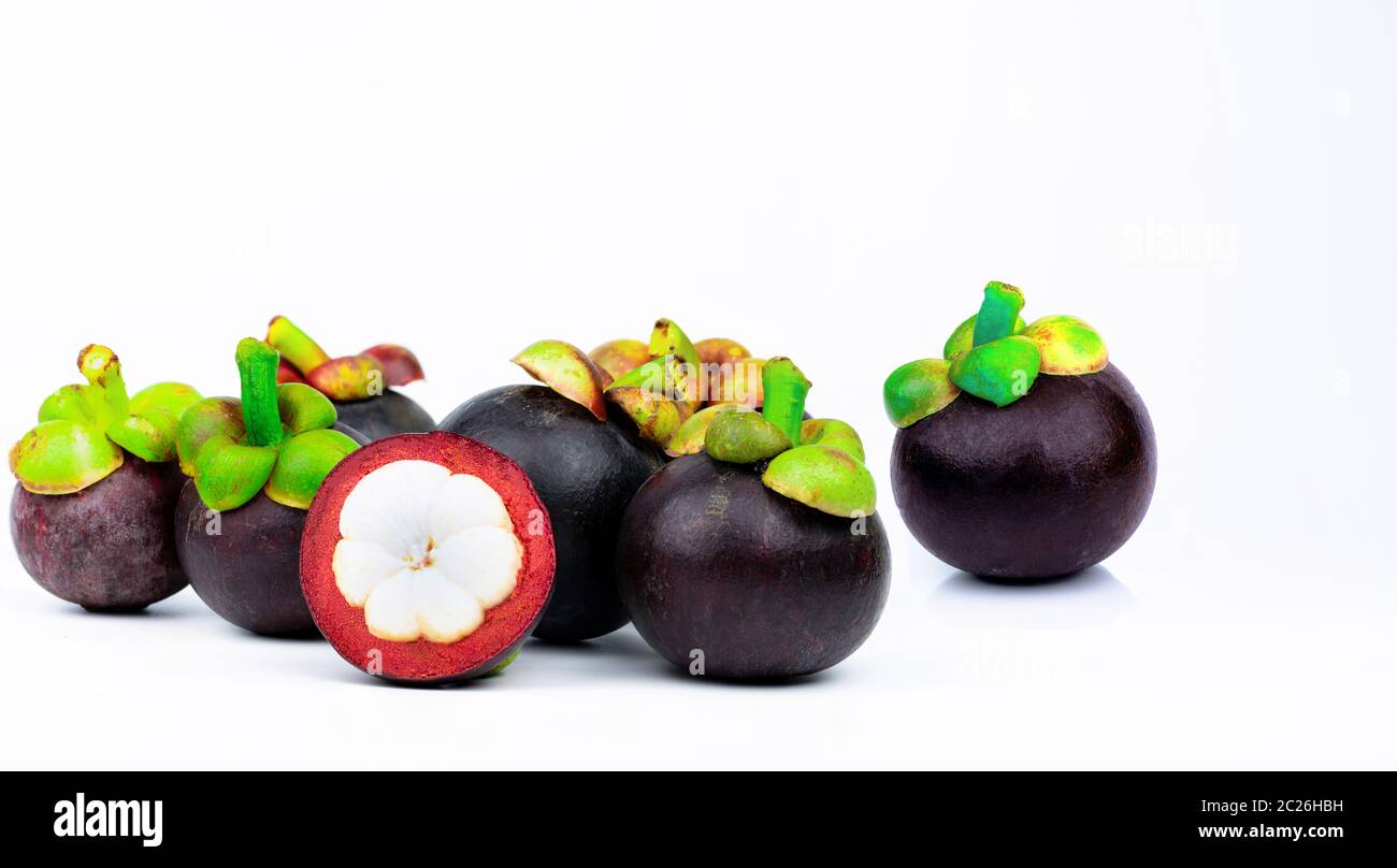 7 whole purple mangosteen and another cross section isolated on white ...