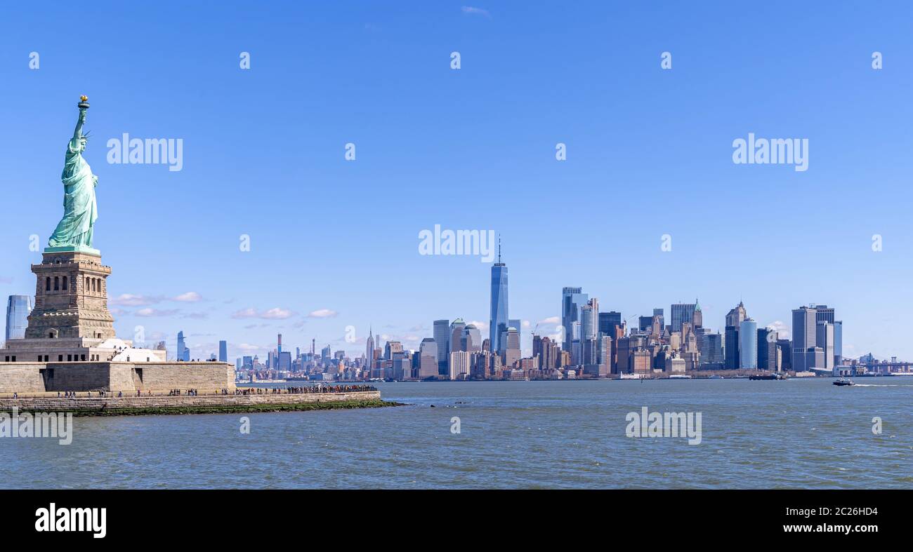 Statue of Liberty with Manhattan downtown Skylines building in ...