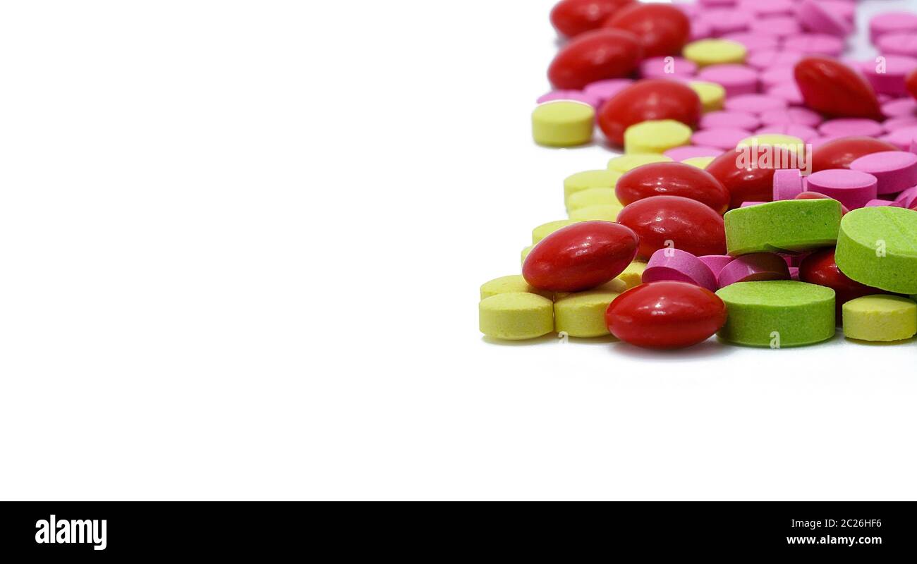 Colorful round tablets pills isolated on white background. Drug ...