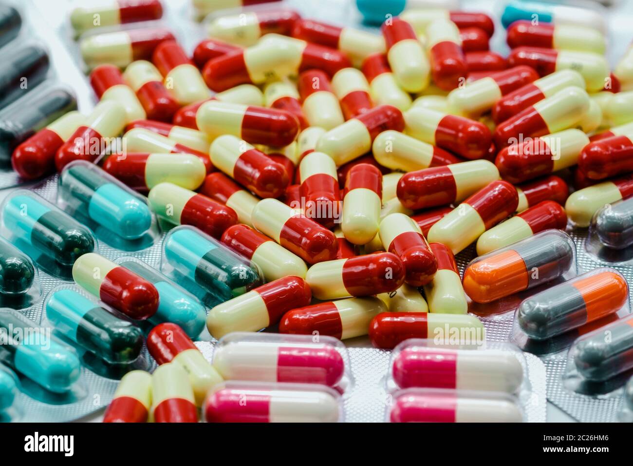 Pile of colorful antibiotic capsule pills. Antimicrobial drug ...