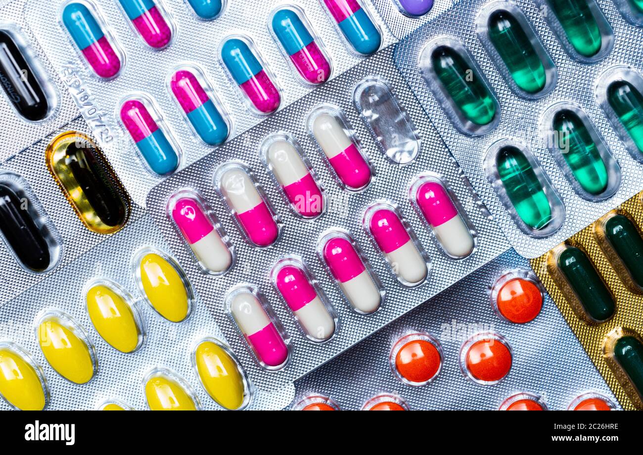 Colorful of tablets and capsules pill in blister packaging arranged ...