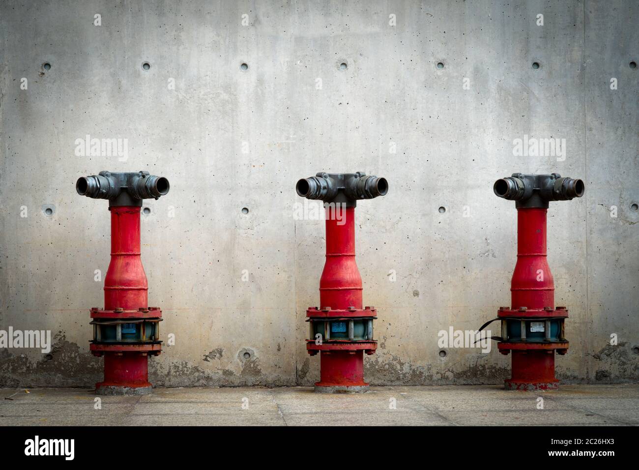Three fire safety pump on cement floor of concrete building. Deluge ...