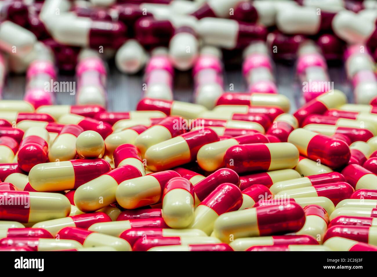 Pile of antibiotic capsule pills. Pharmaceutical industry. Drug ...