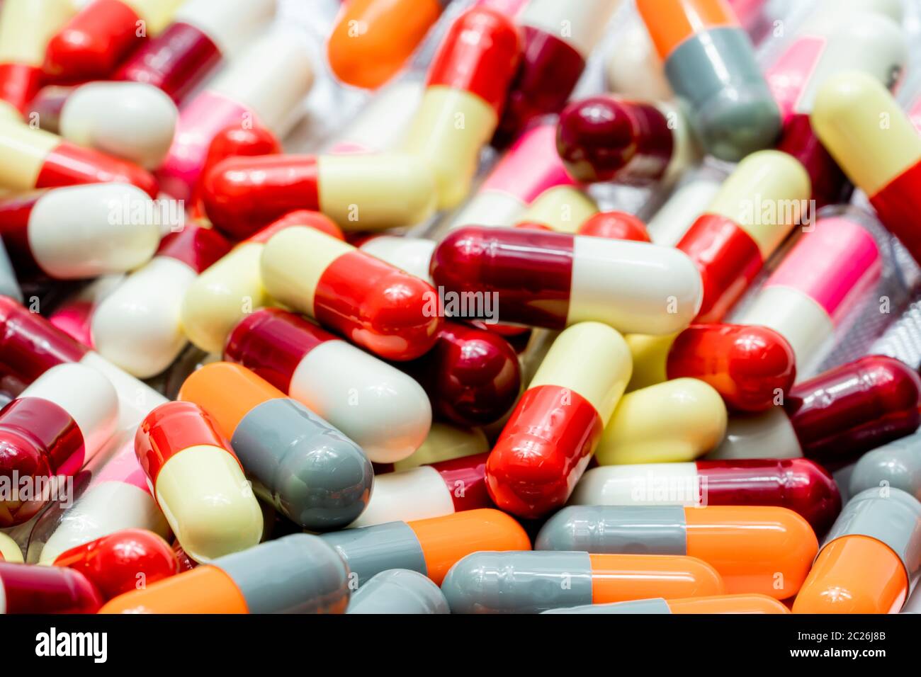 Pile of antibiotic capsule pills. Pharmaceutical industry. Drug ...