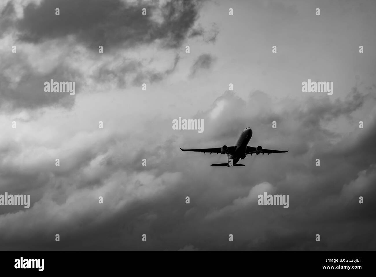 Commercial airplane on grey sky and clouds with copy space. Failed ...