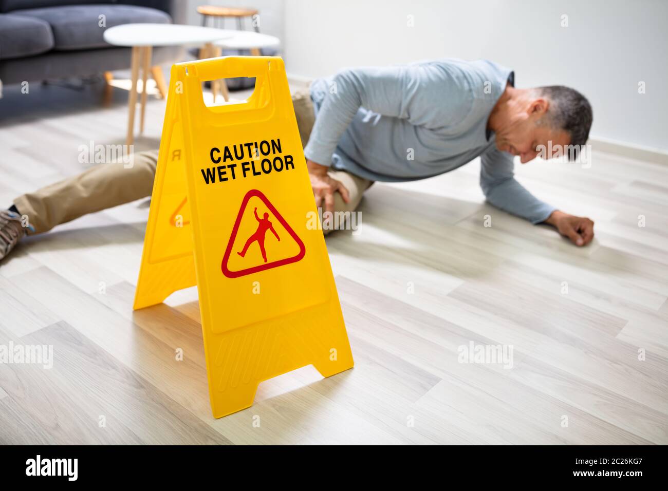 Man falling wet floor hi-res stock photography and images - Alamy