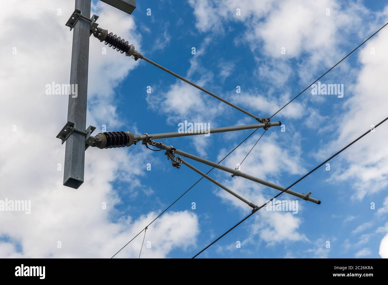 View of a German way catenary in front of blue sky with clouds like ...