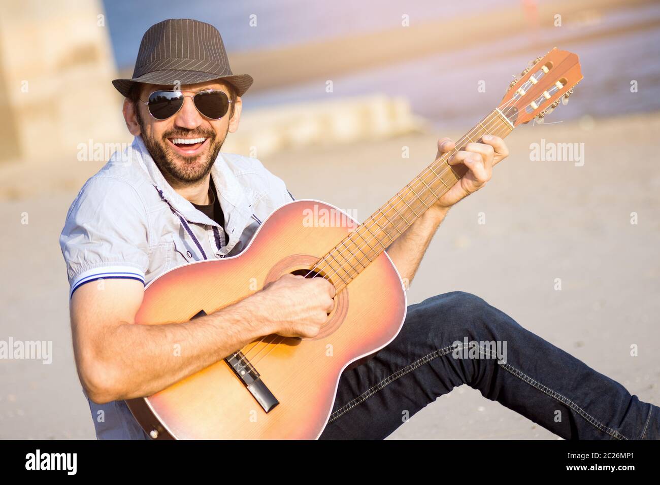 Smiling guitar man life hi-res stock photography and images - Alamy