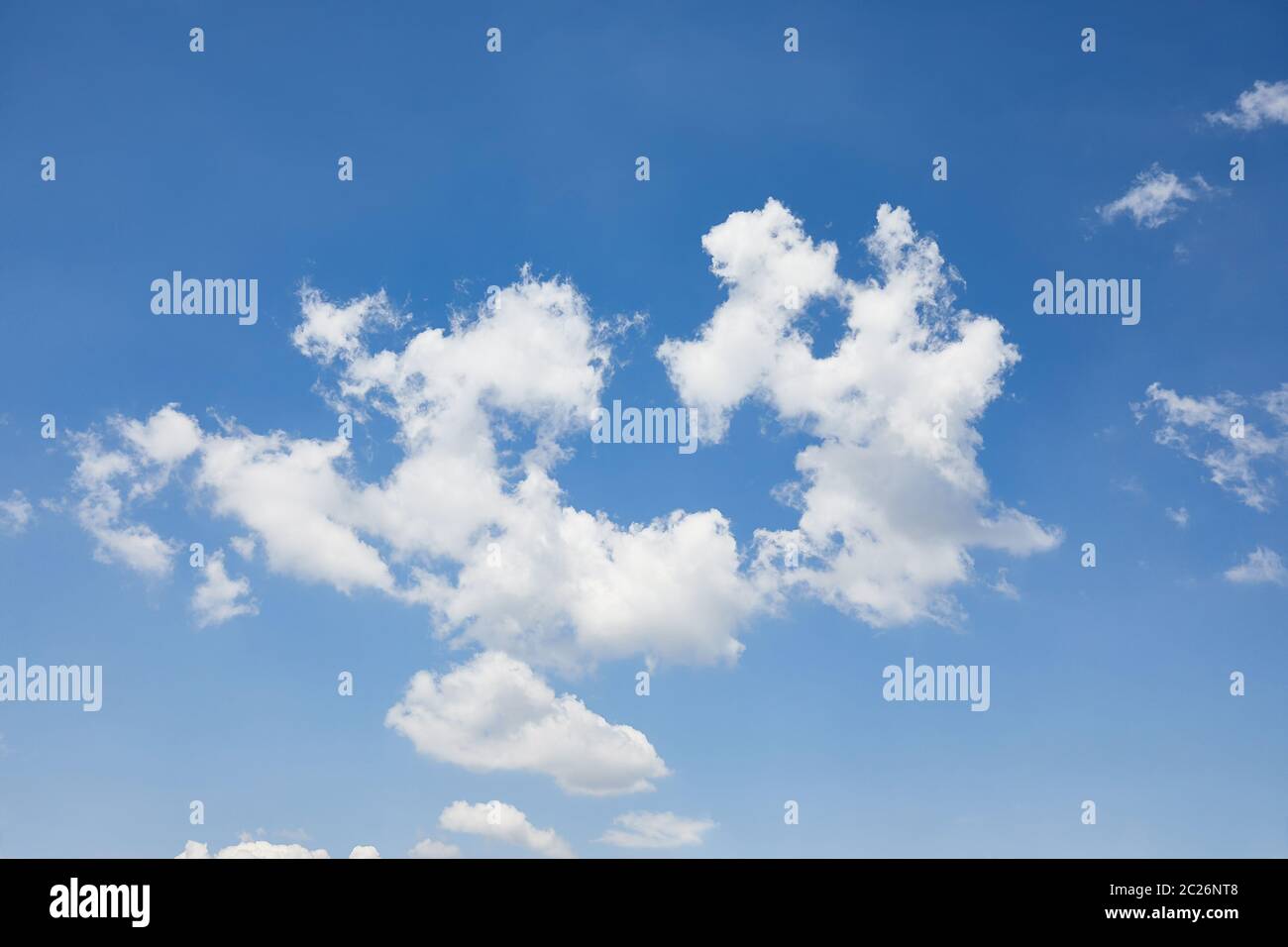Small white clouds in bright blue sky Stock Photo - Alamy