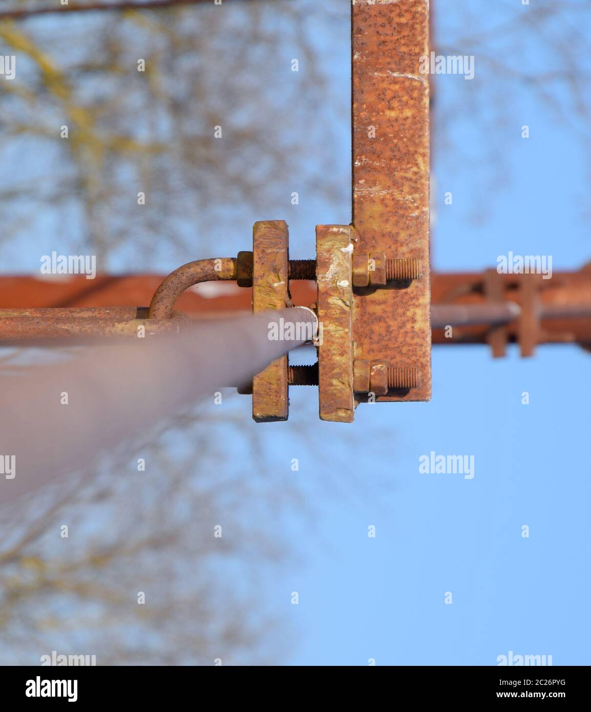 Fastening clamp on the steel cable of the bridge. Connecting elements ...