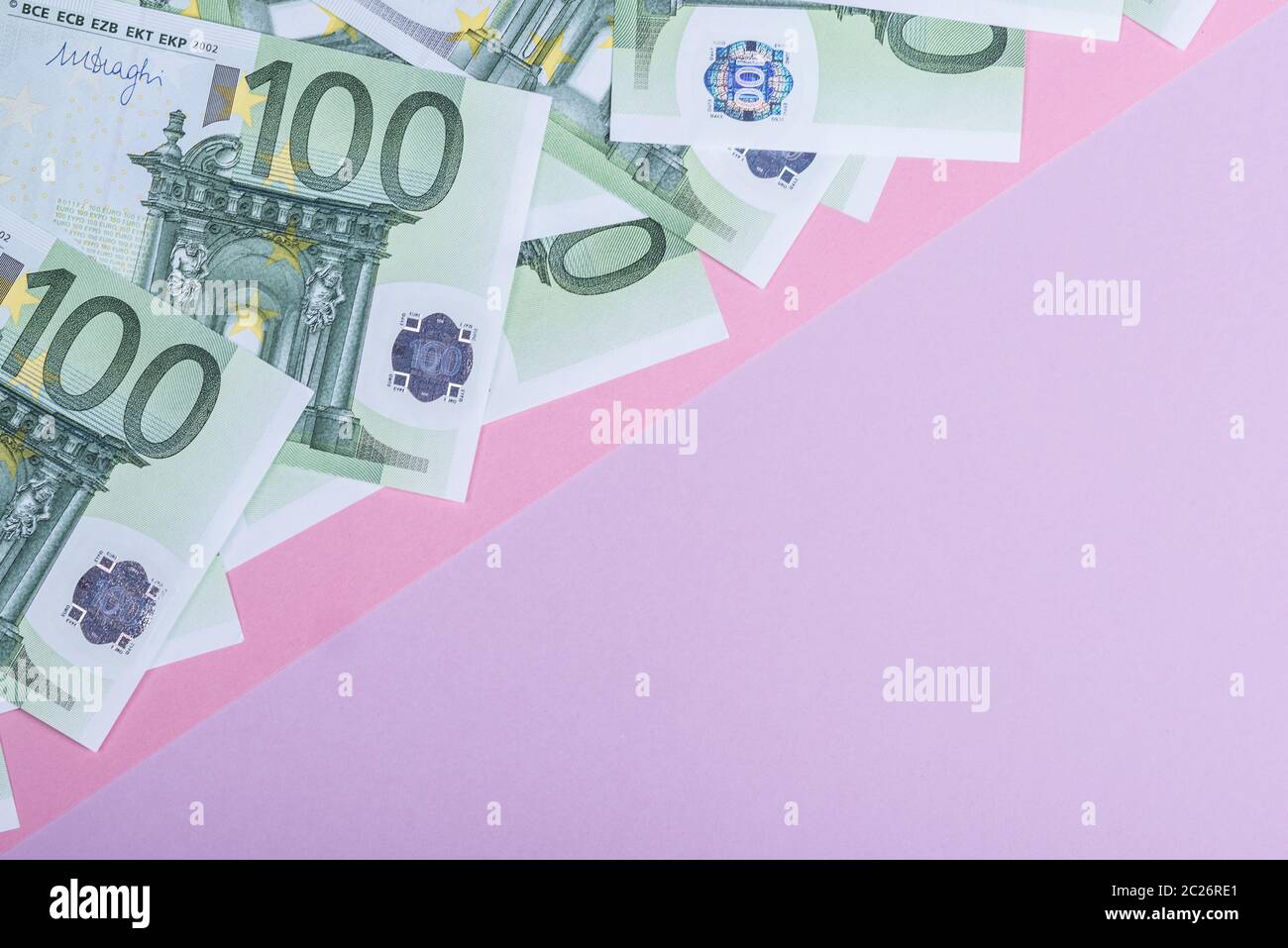 Euro cash on a lilac, purple and pink background. Euro Money Banknotes ...