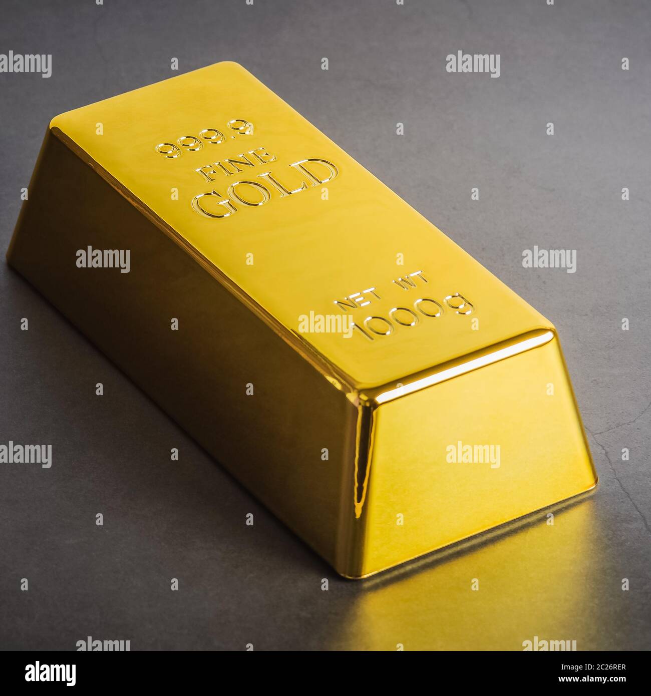 Gold bar ingot bullion on a gray background. Located diagonally Stock ...