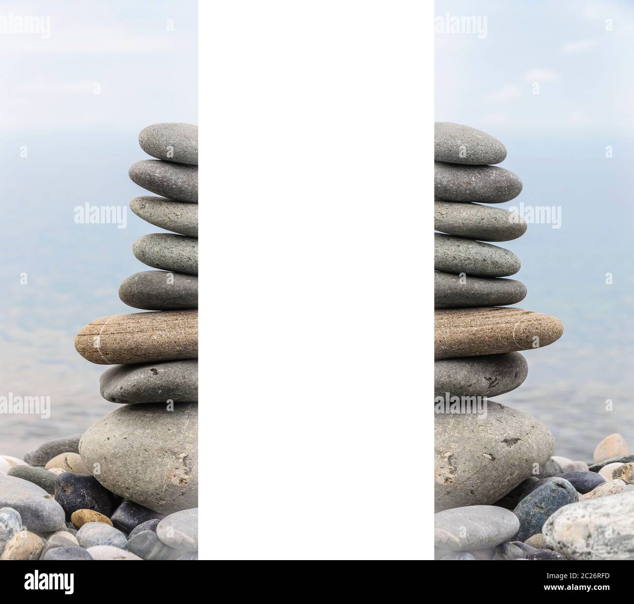 Pyramid of sea stones on pebbles of the sea shore. Seascape. The ...
