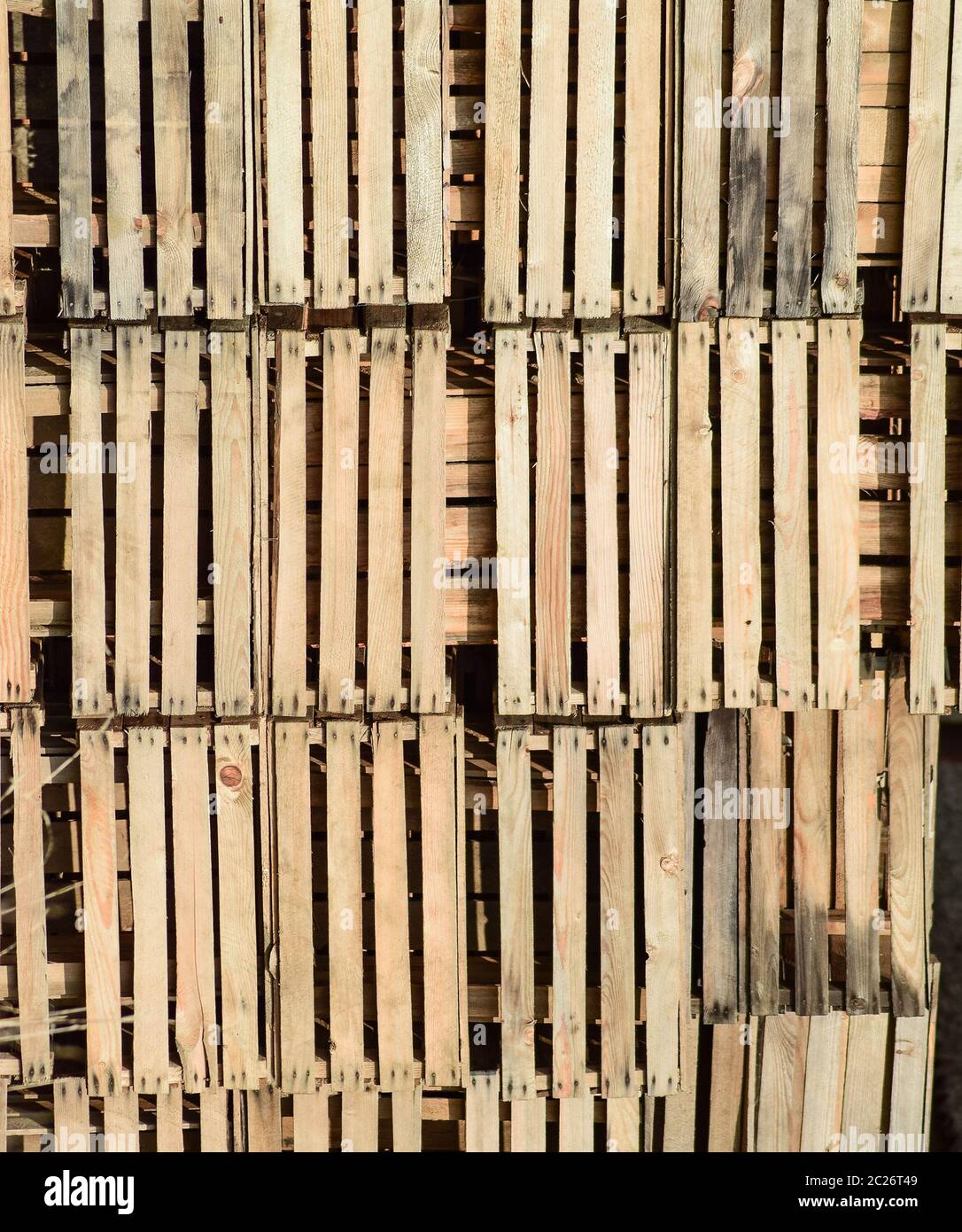 Wooden boxes stacked together. Warehouse empty wooden containers Stock ...