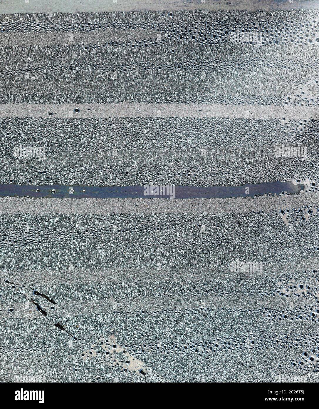 Background of the condensate drops on the film is polyethylene. Water ...