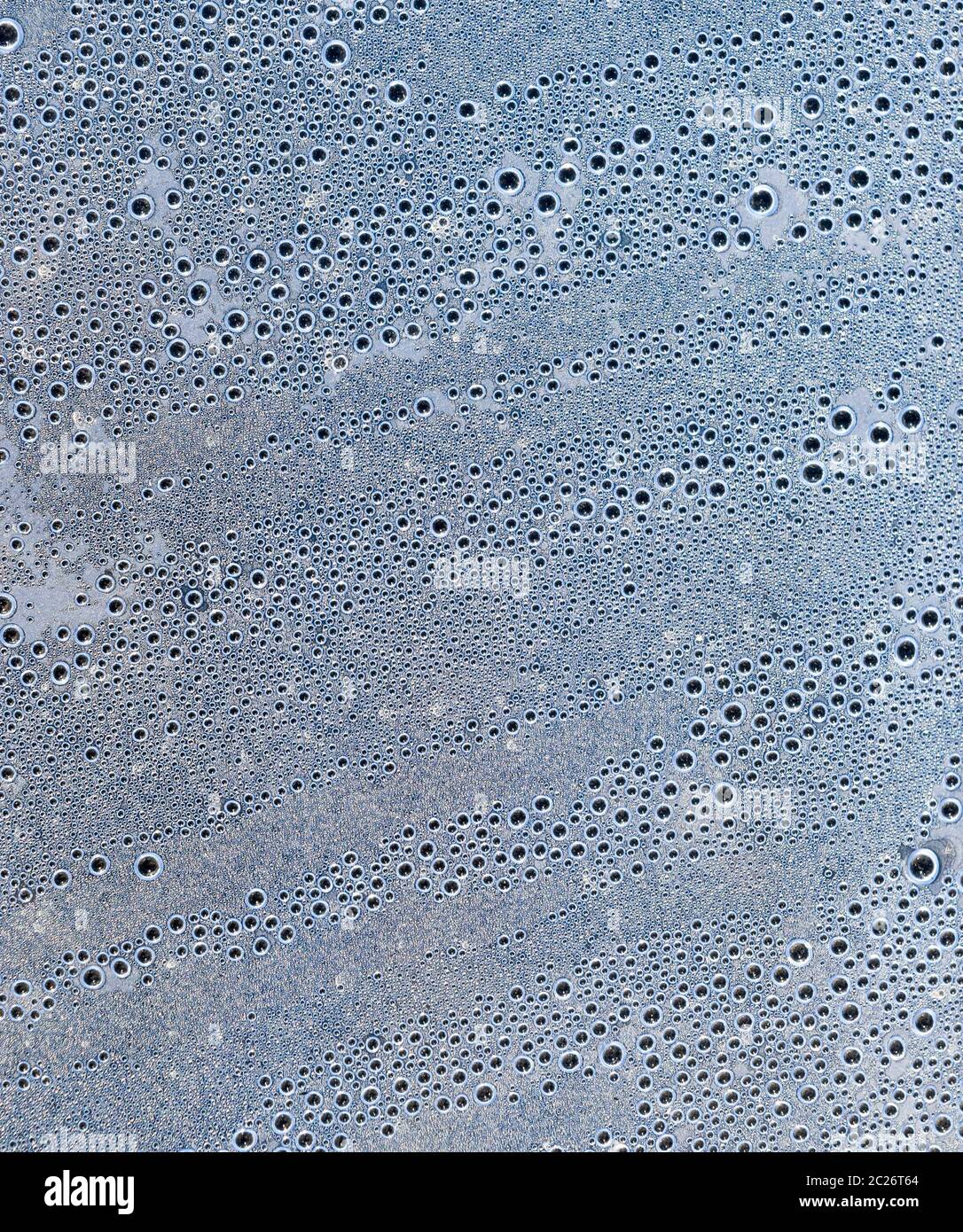 Background of the condensate drops on the film is polyethylene. Water ...