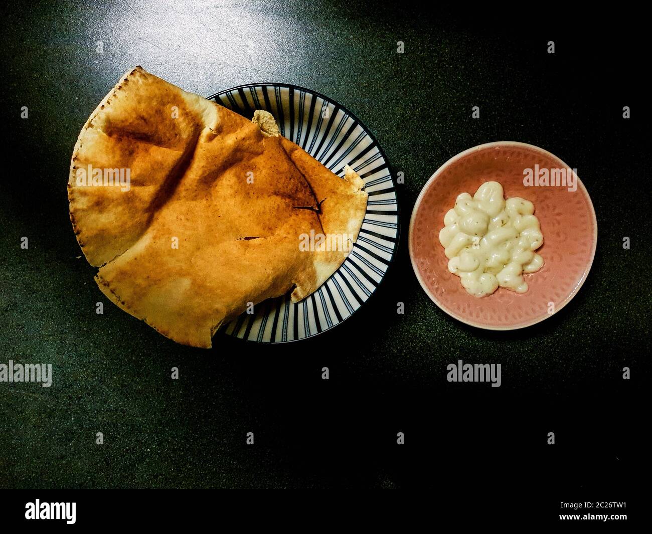 Arabian Lebanese Bread with garlic sauce top view snack Stock Photo - Alamy