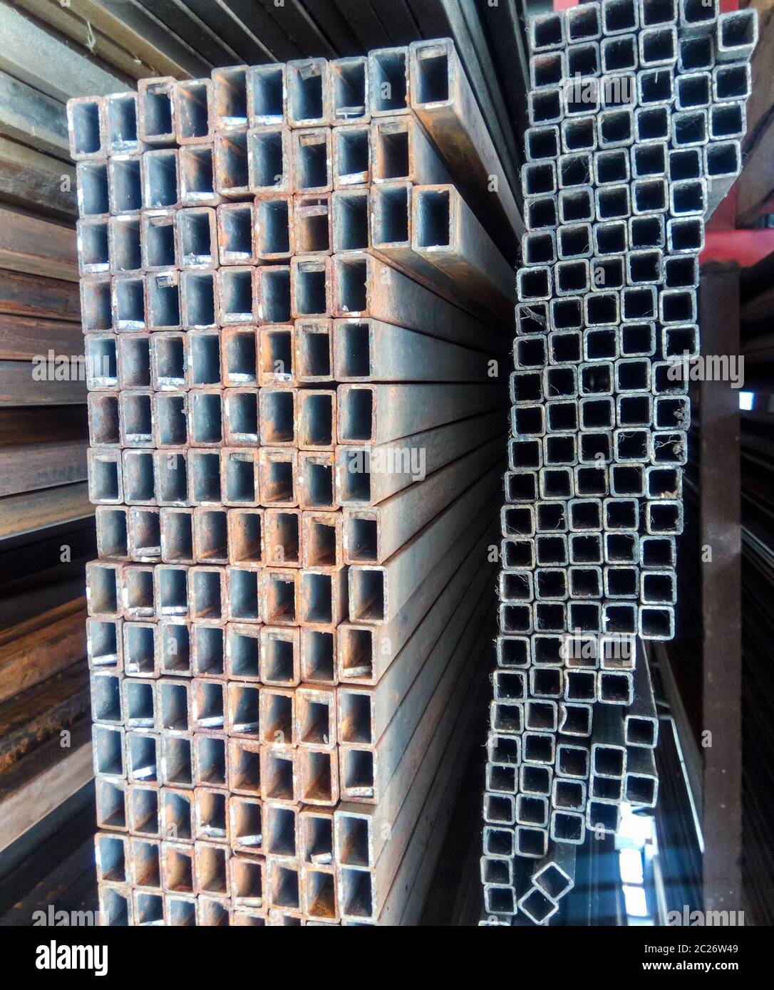 Metalwork profile tubing. Steel bars of rolled metal Stock Photo - Alamy