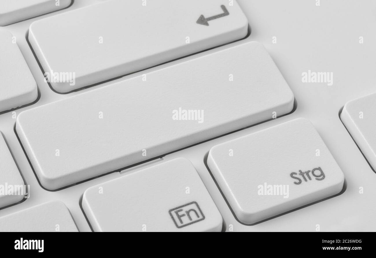 A keyboard with an unlabeled button Stock Photo - Alamy